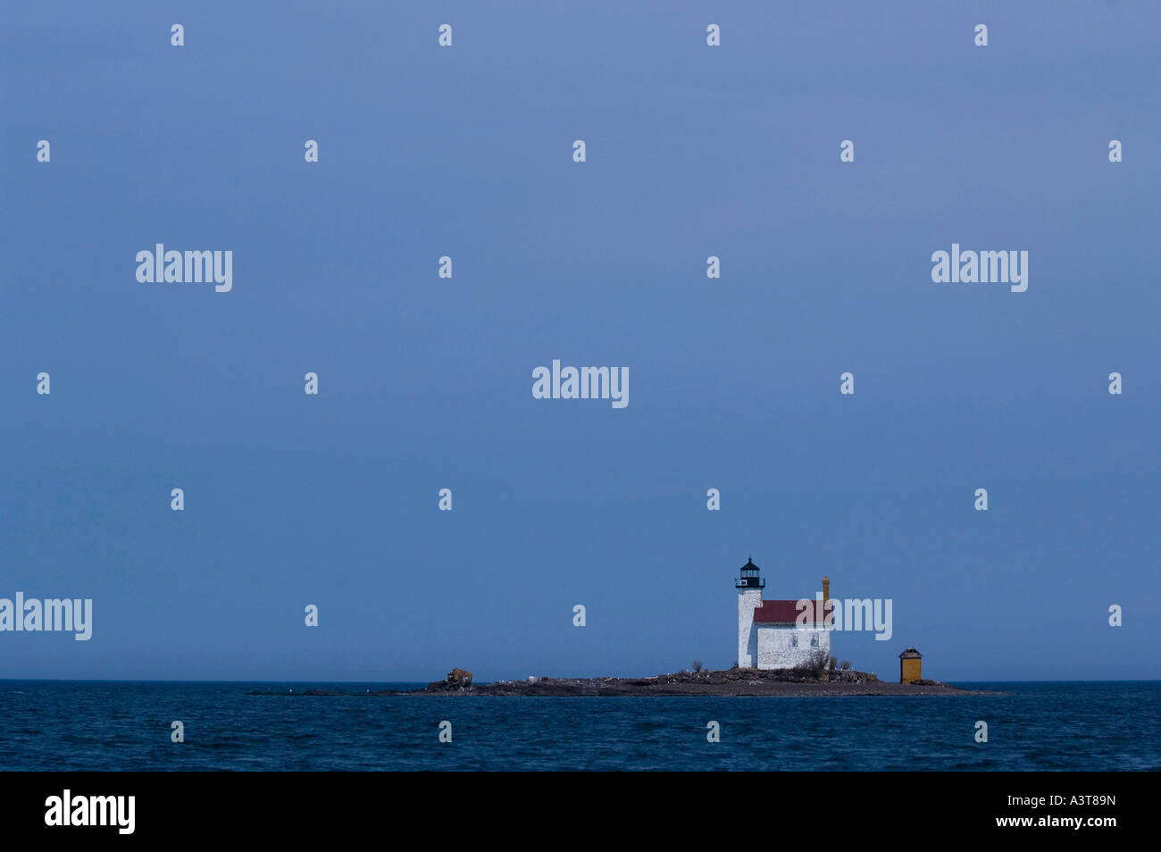 Gull Rock Lighthouse is a speck on the horizon of Lake Superior near ...