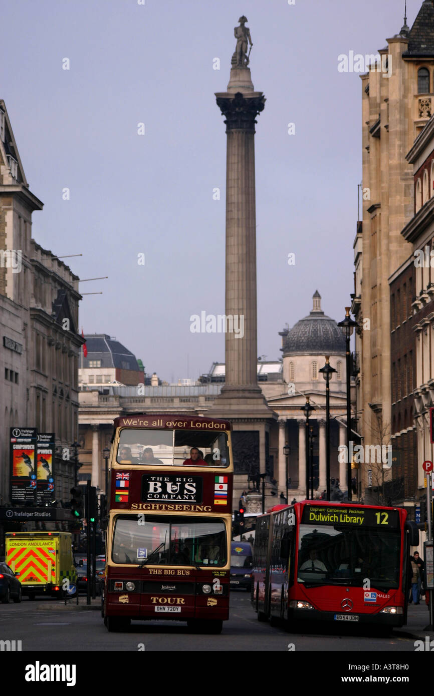Nelsons Column Trafalgar Square and buses in the foreground London ...