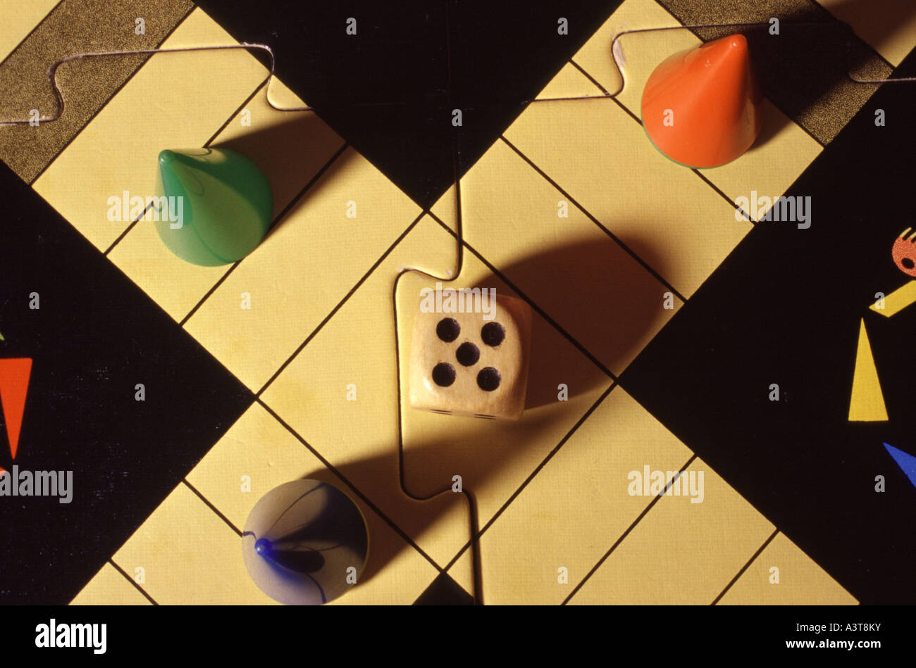 Trap the Cap, token and cube Stock Photo - Alamy