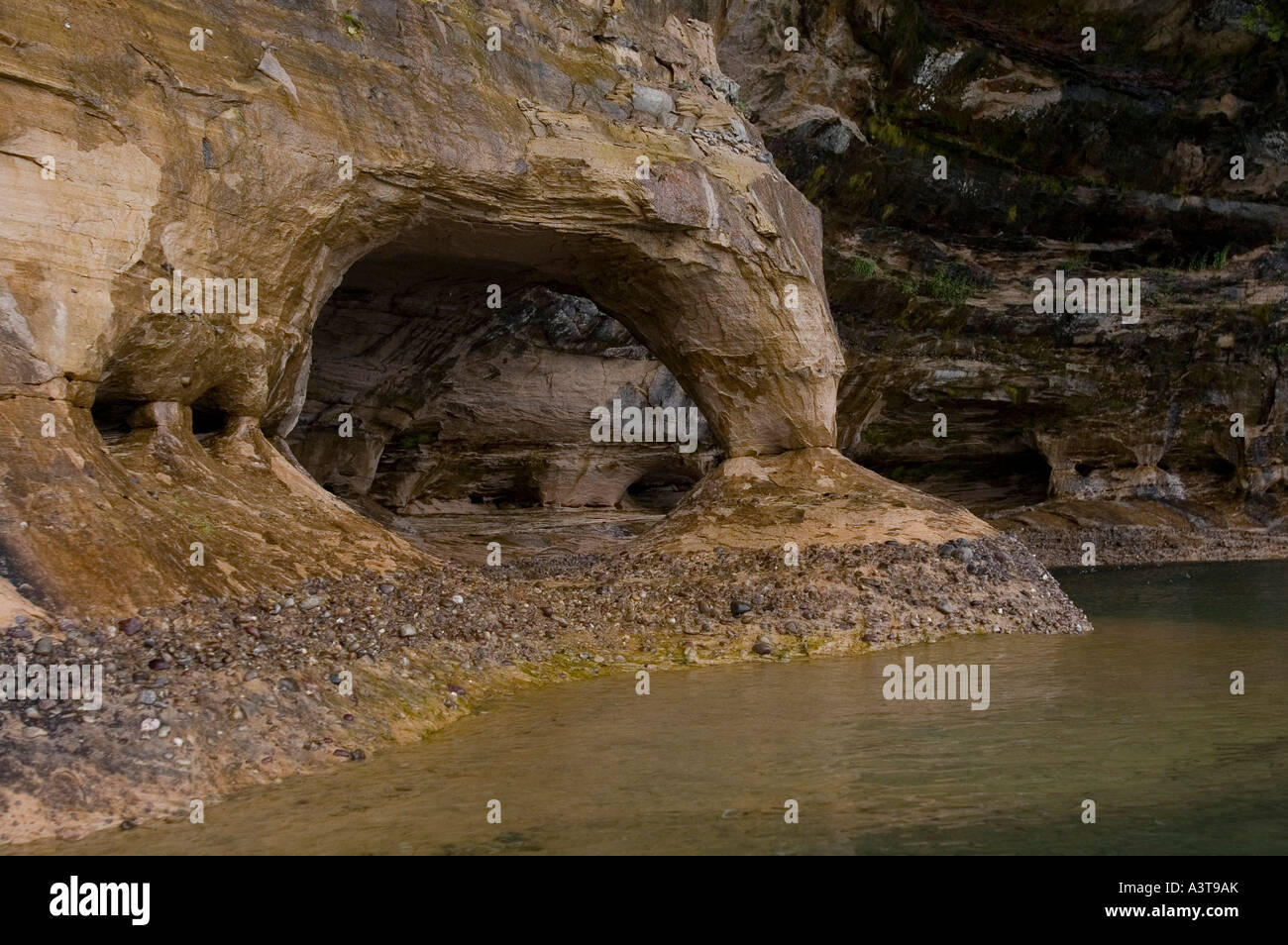 Small sea caves in the sandstone shoreline of Grand Island National ...
