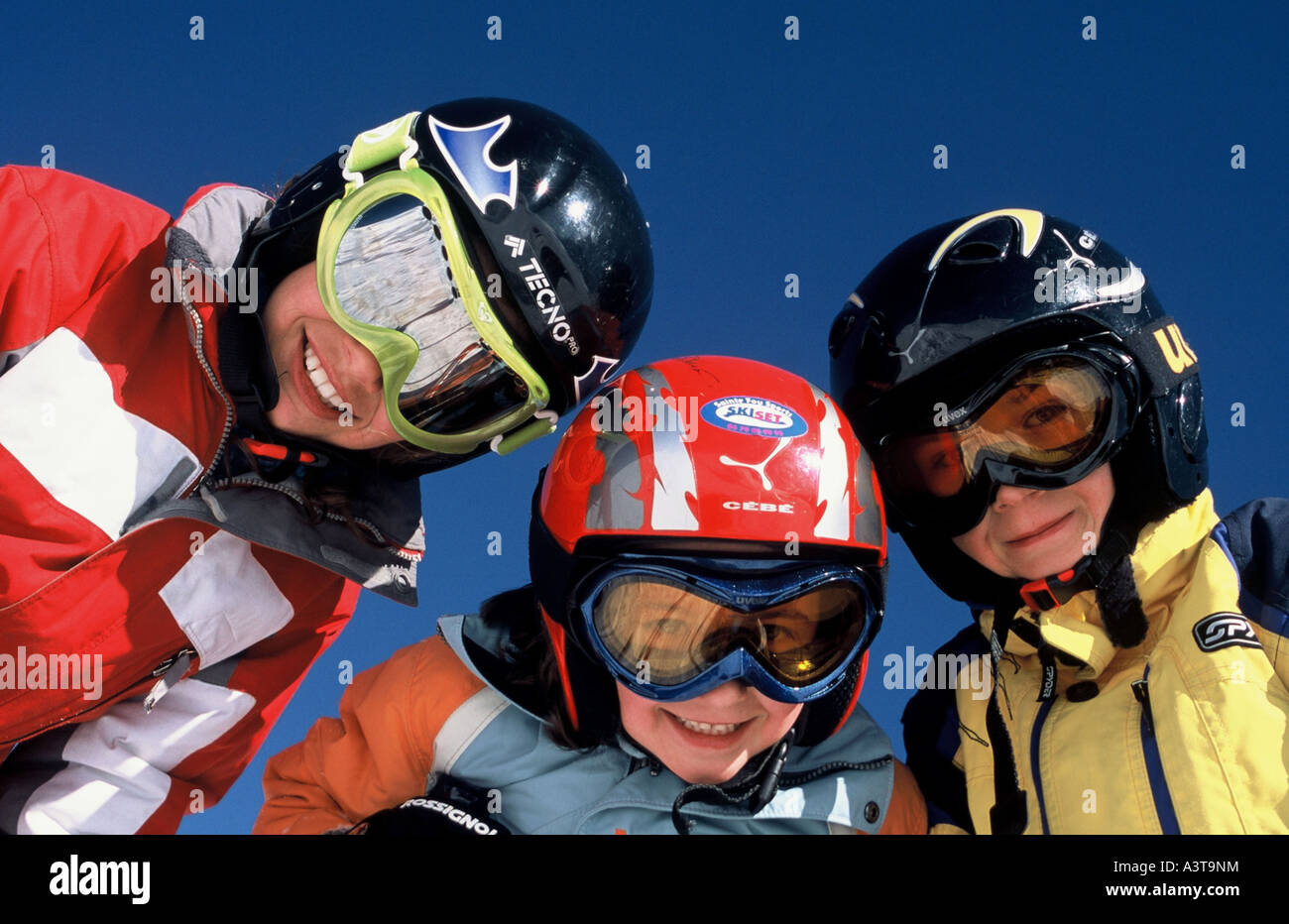 three children with skiing clothes, France, Alps Stock Photo - Alamy