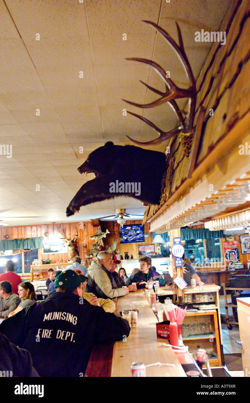 Bar scene from the Bear Trap Inn in Van Meer Michigan showing whitetail ...