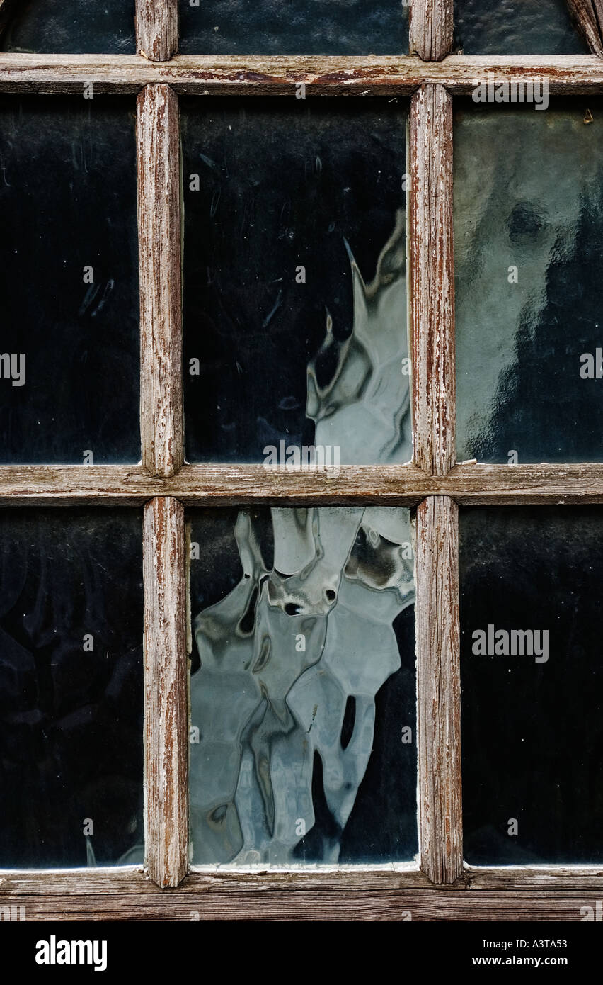 Ladder seen through a leaded glass window Stock Photo - Alamy