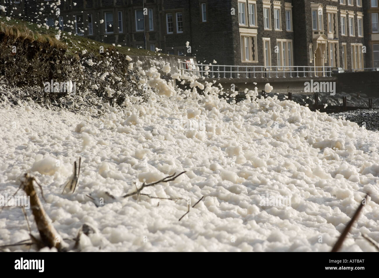 Drifts of white sea water spume blown by strong winds at Aberystwyth ...