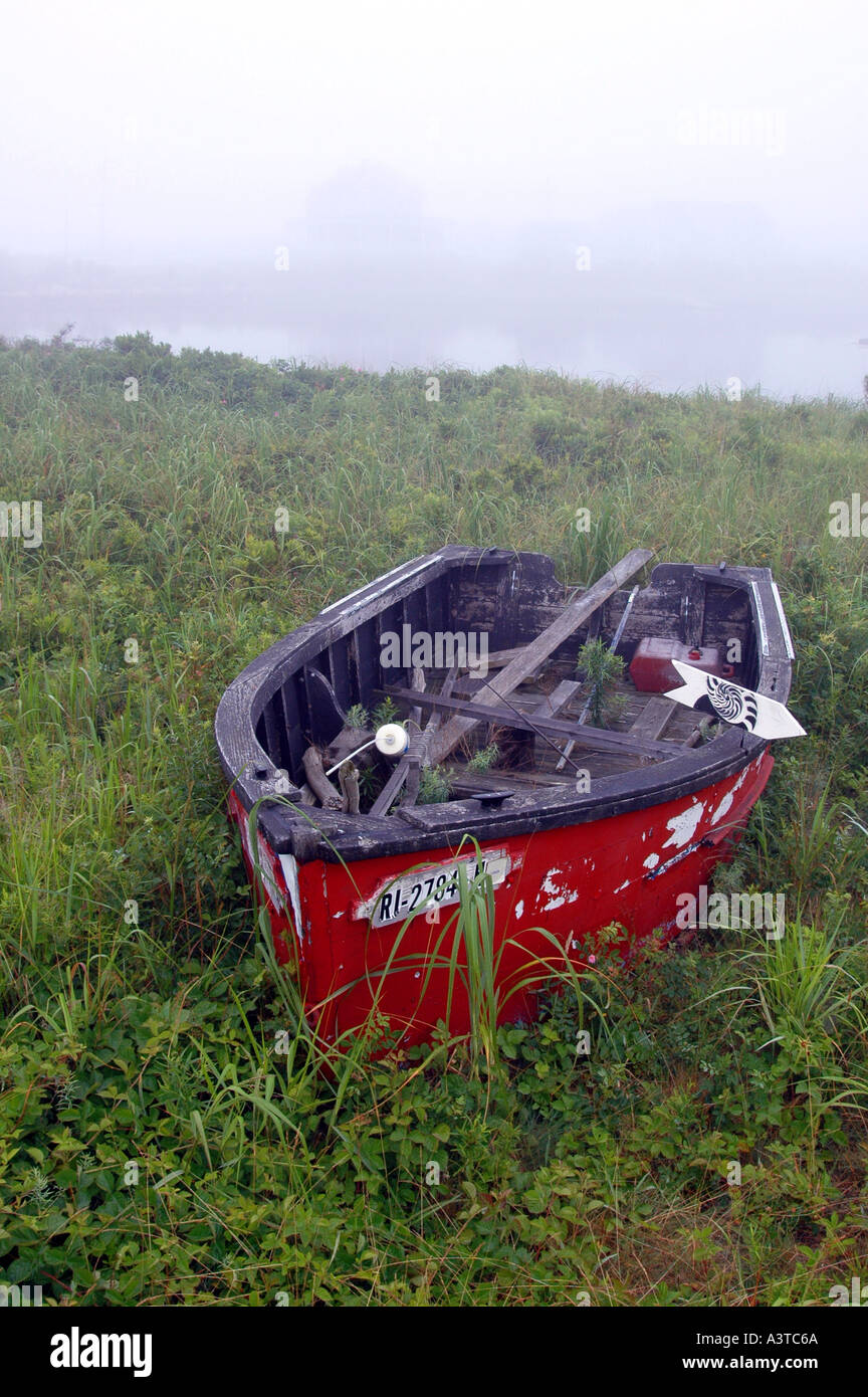 Old row boat on misty shore Stock Photo - Alamy