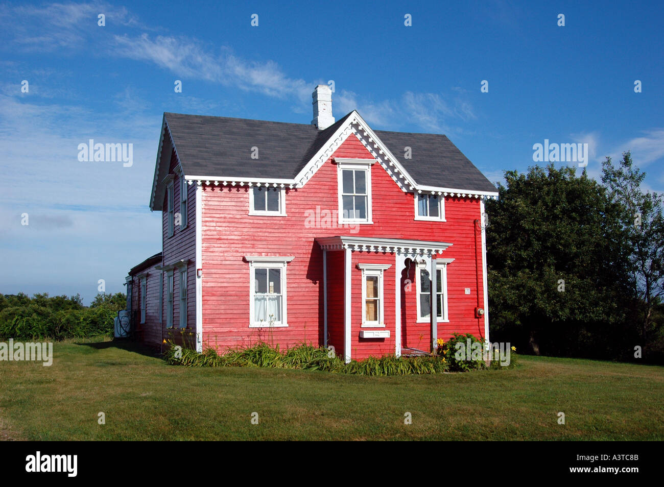 Bright red house with blue sky cottage on Block Island Rhode Island ...