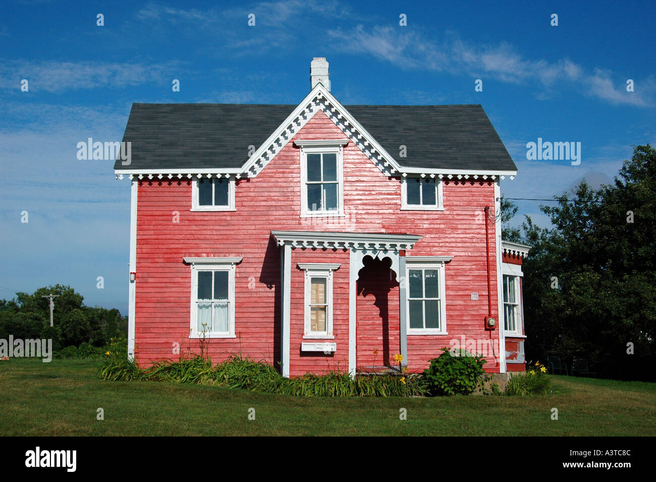 Bright red house with blue sky cottage on Block Island Rhode Island ...