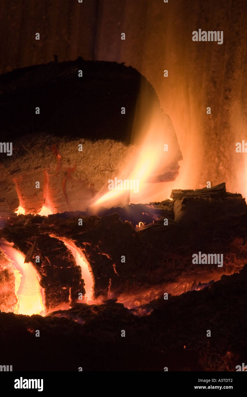 Burning logs alight inside a wood burning stove Stock Photo - Alamy