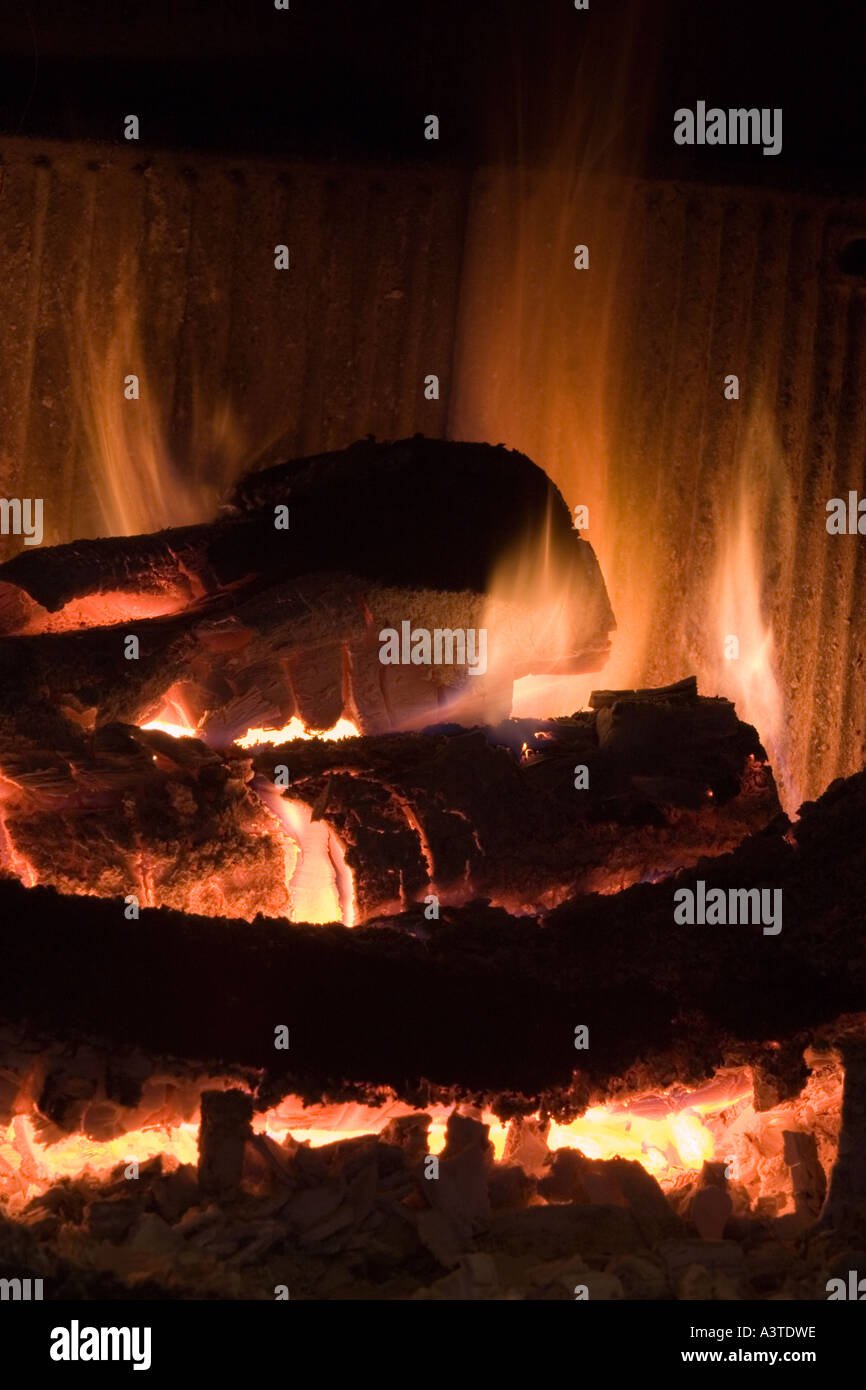Burning logs alight inside a wood burning stove Stock Photo - Alamy