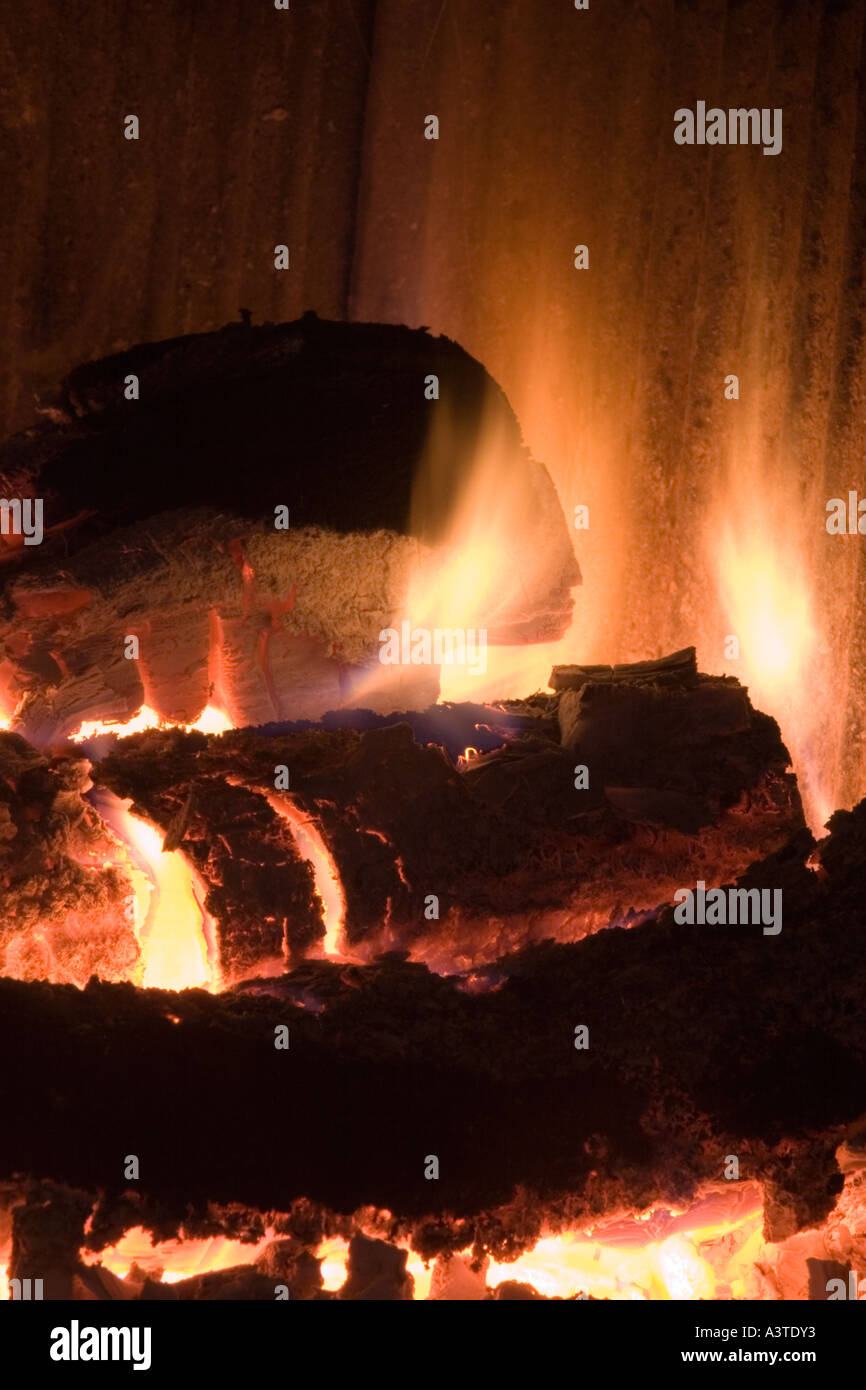 Burning logs alight inside a wood burning stove Stock Photo - Alamy