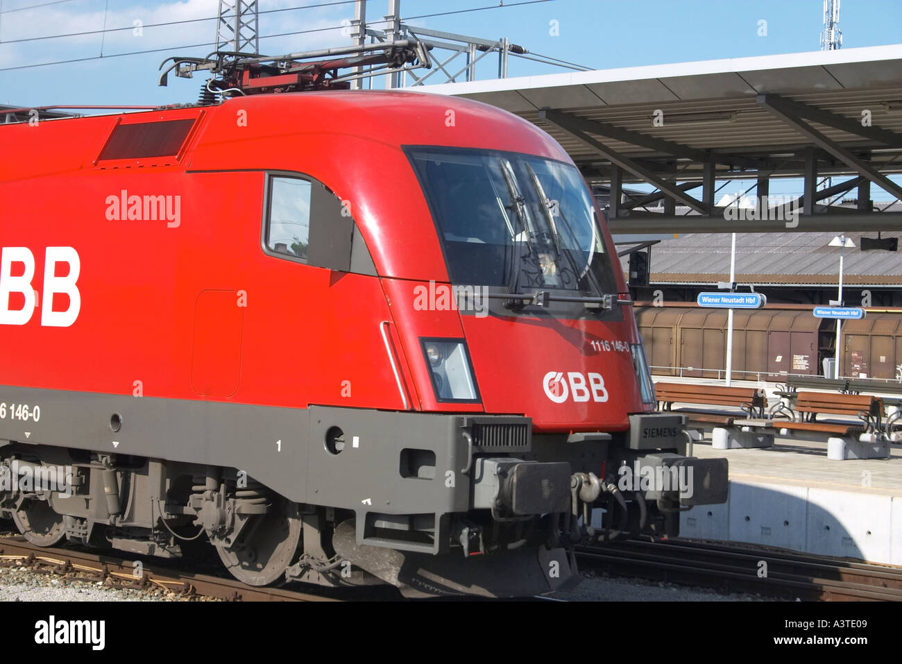 red locomotive in train station Stock Photo - Alamy