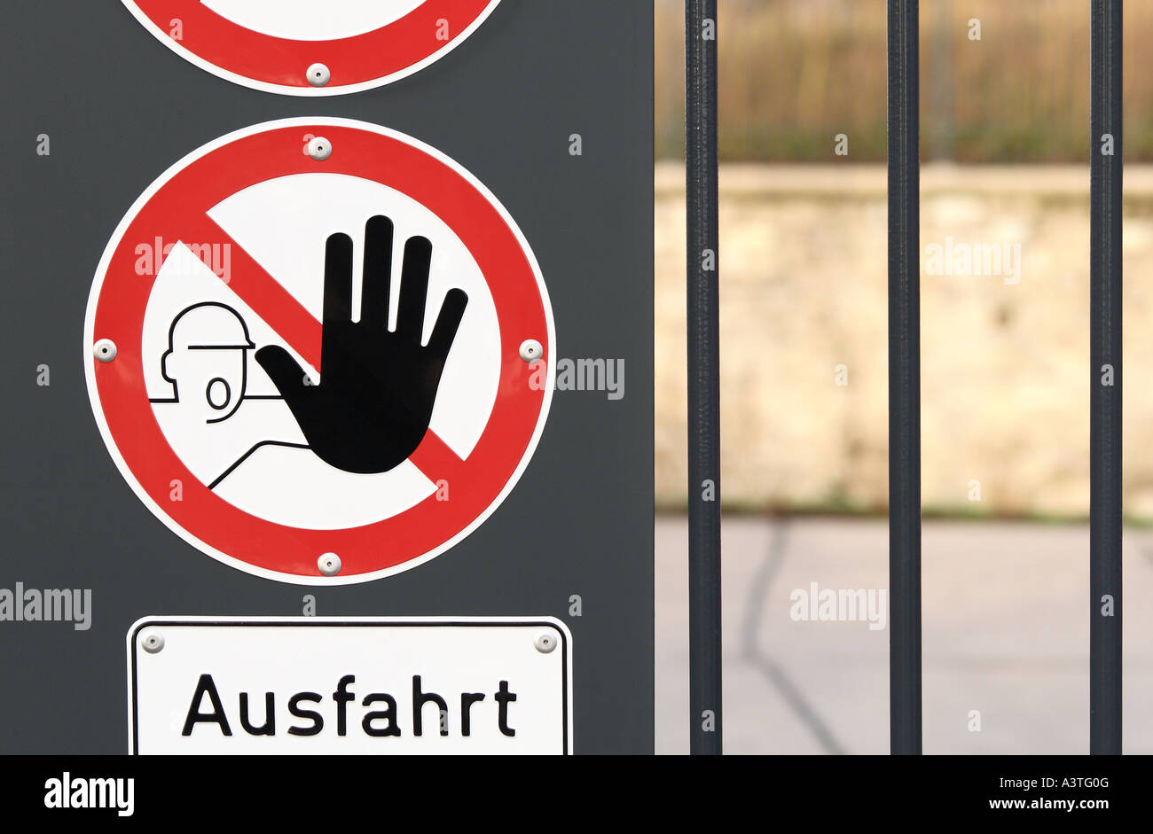 Warning sign and sign Ausfahrt exit on a gate Stock Photo - Alamy