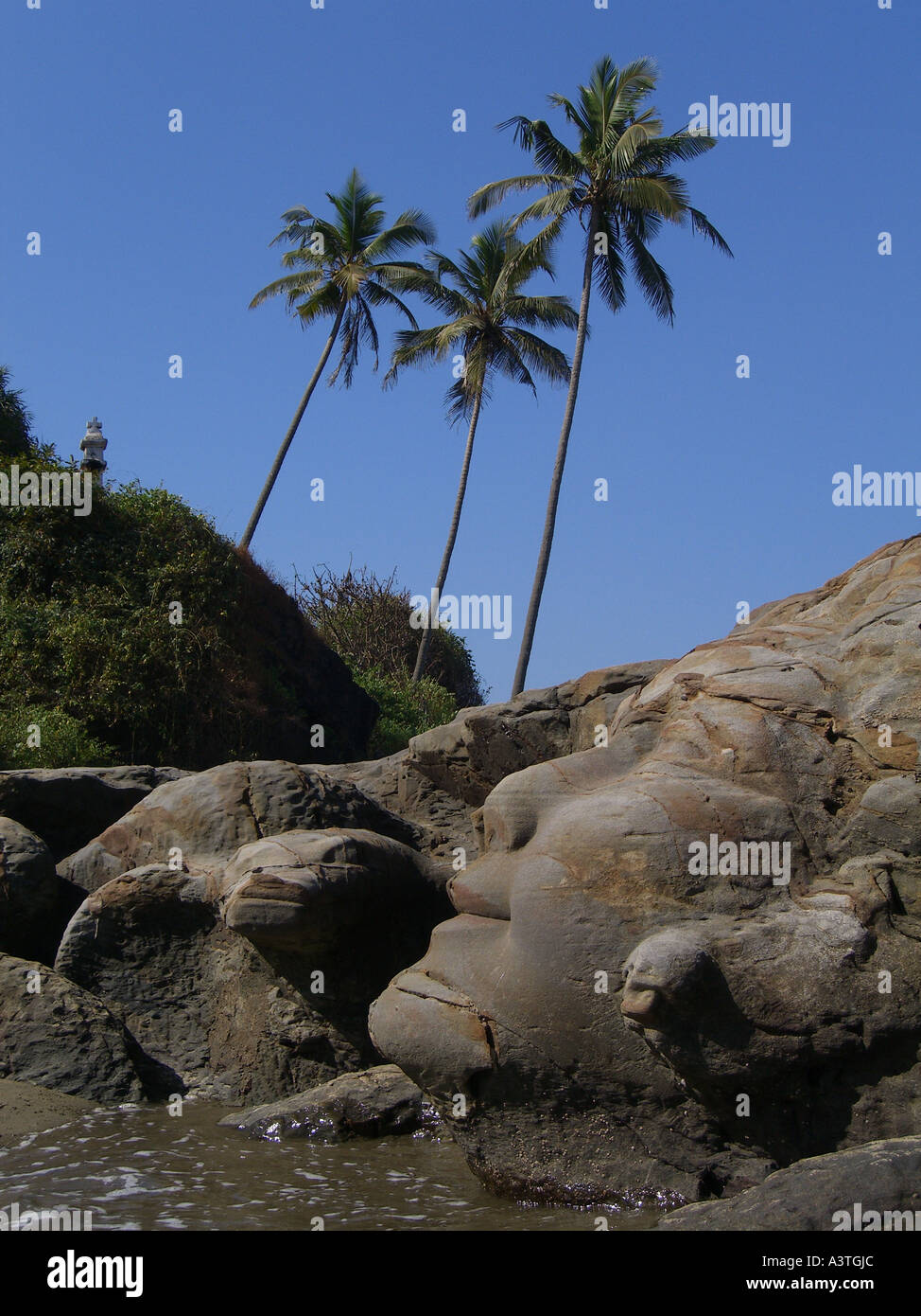 The Shiva sculpture on the rock, in small Vagator beach (State of Goa ...
