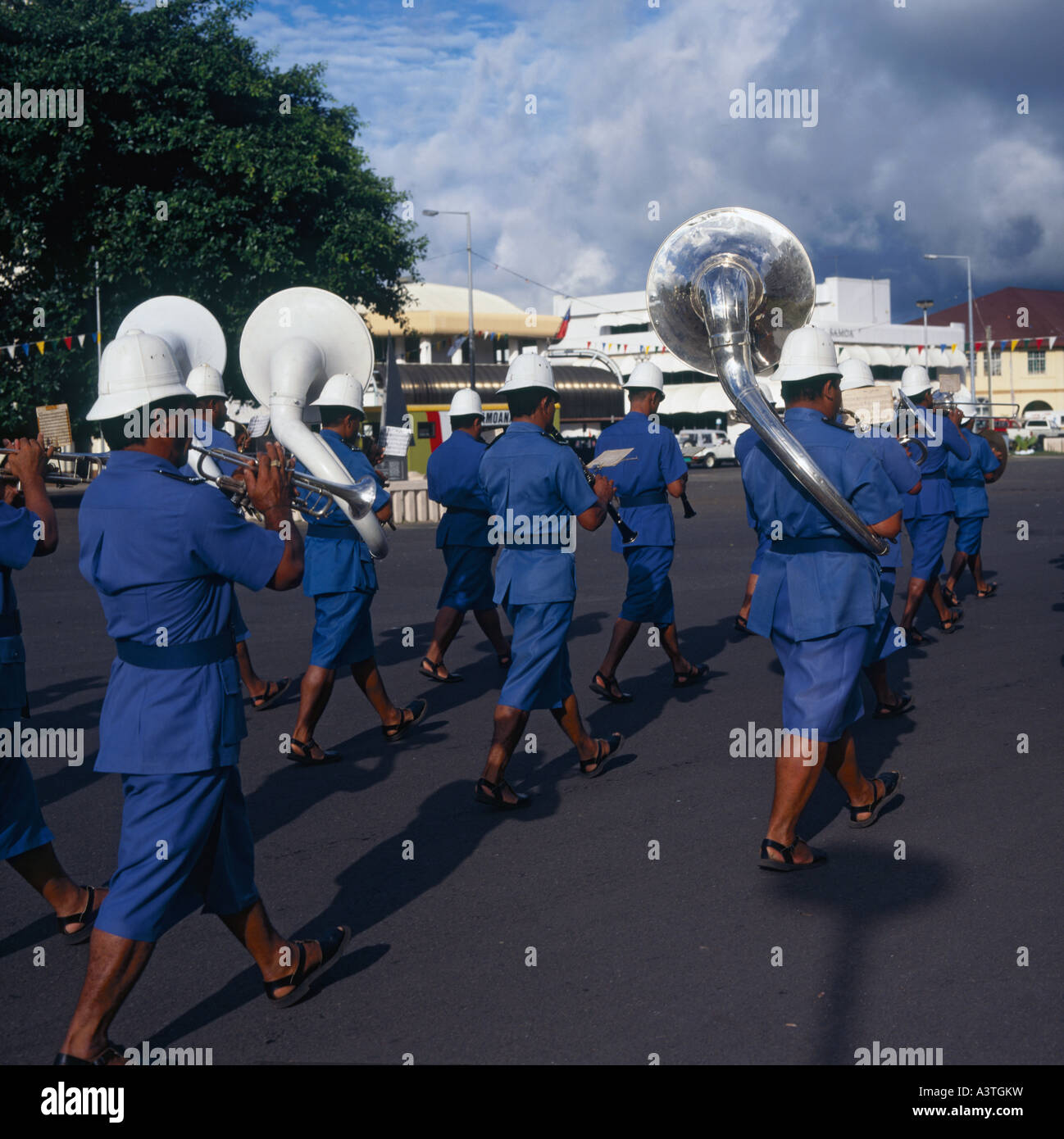 Back view of the local police band marching as they play in the main ...