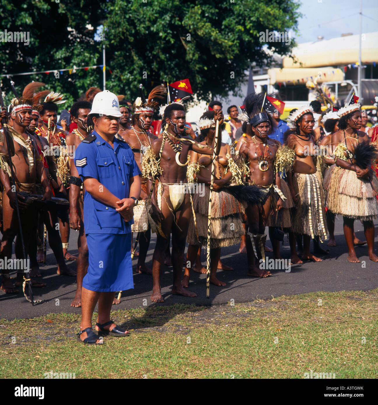 Group of indigenous people from Papua New Guinea and local policeman at ...