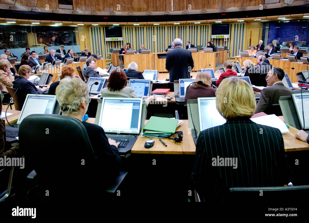 Senedd Welsh Assembly Debating Chamber AMs sit in front of their ...