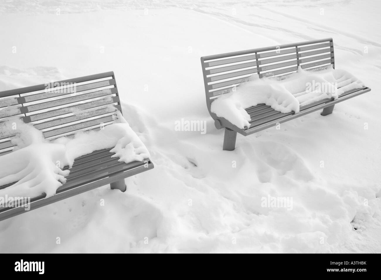 Snow covered benches Stock Photo - Alamy