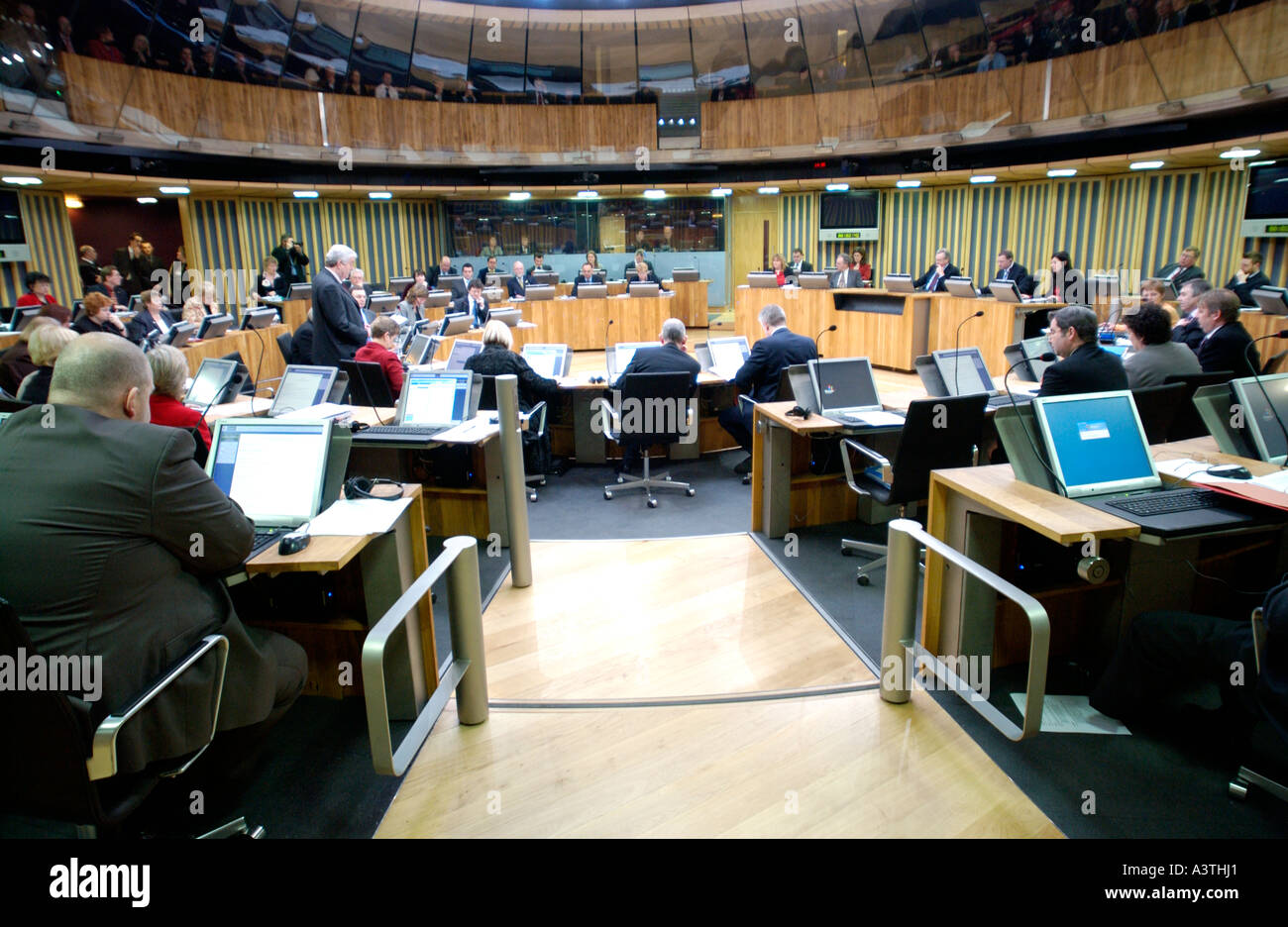 Senedd Welsh Assembly Debating Chamber AMs sit in front of their ...