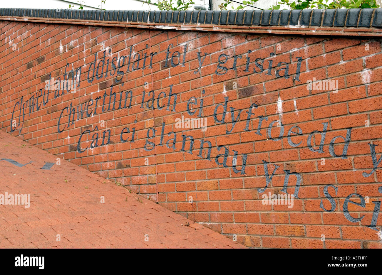 Relief sculpture of welsh poem in brick in the former coal mining town ...