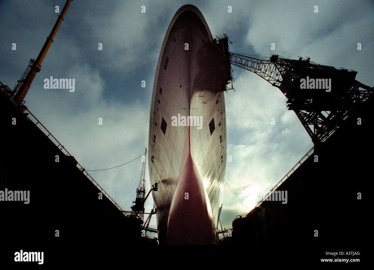 The Cunard liner QE2 undergoing a refit and repaint in dry dock in ...