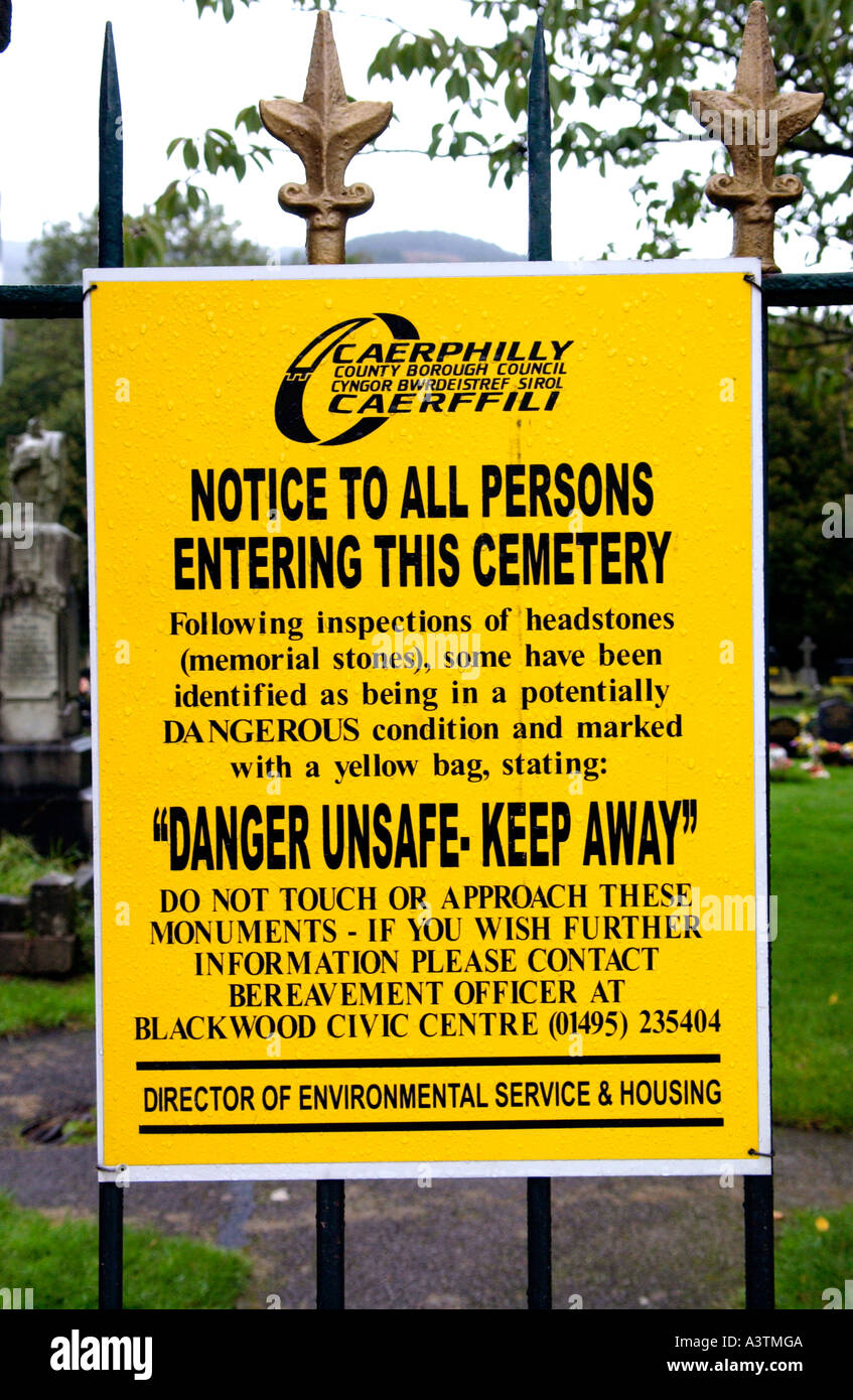 Unsafe headstones with yellow warning notices at a cemetery in Risca ...