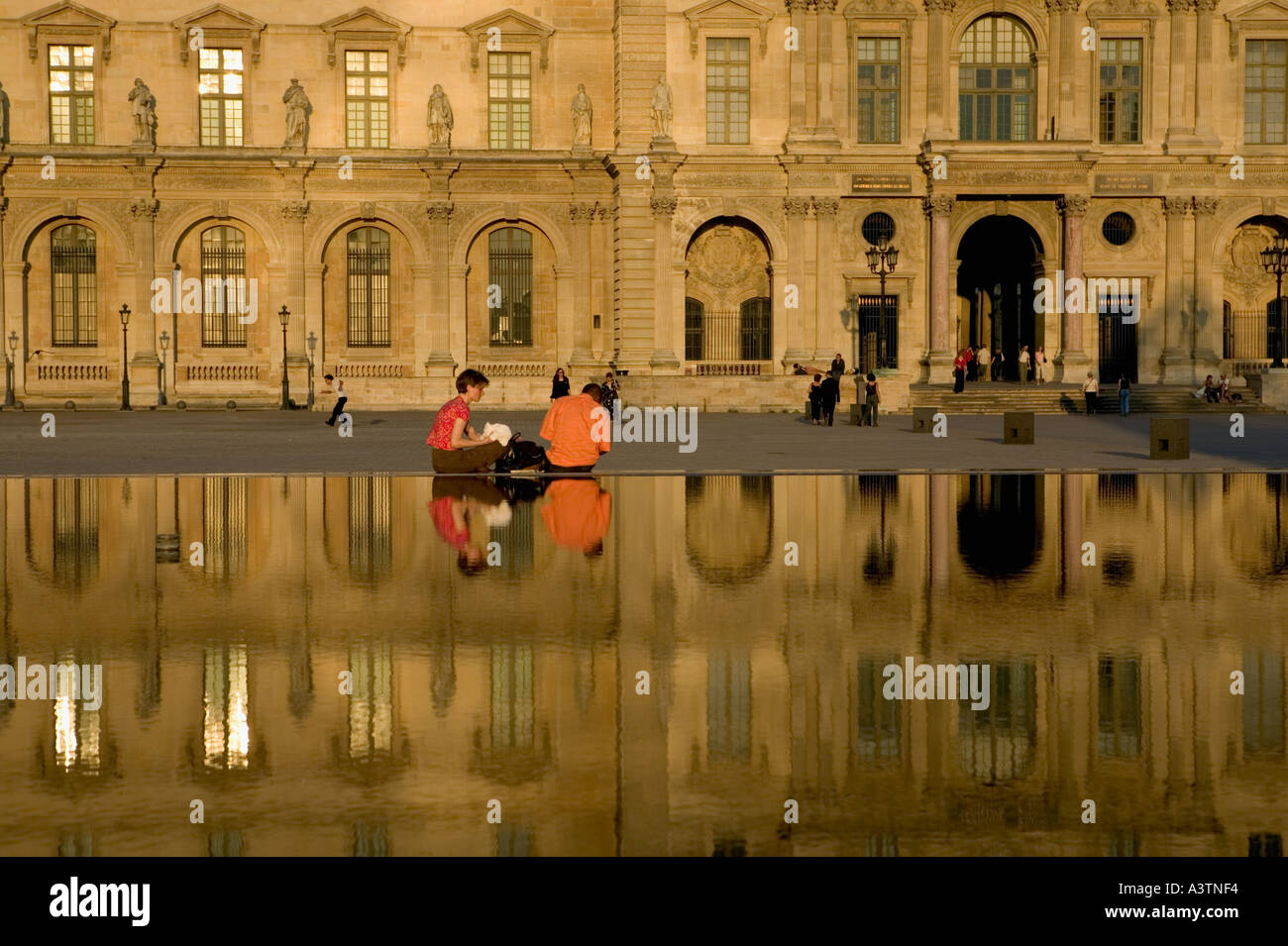 Louvre reflected in fountain in the Cour Napoleon Paris France Stock ...