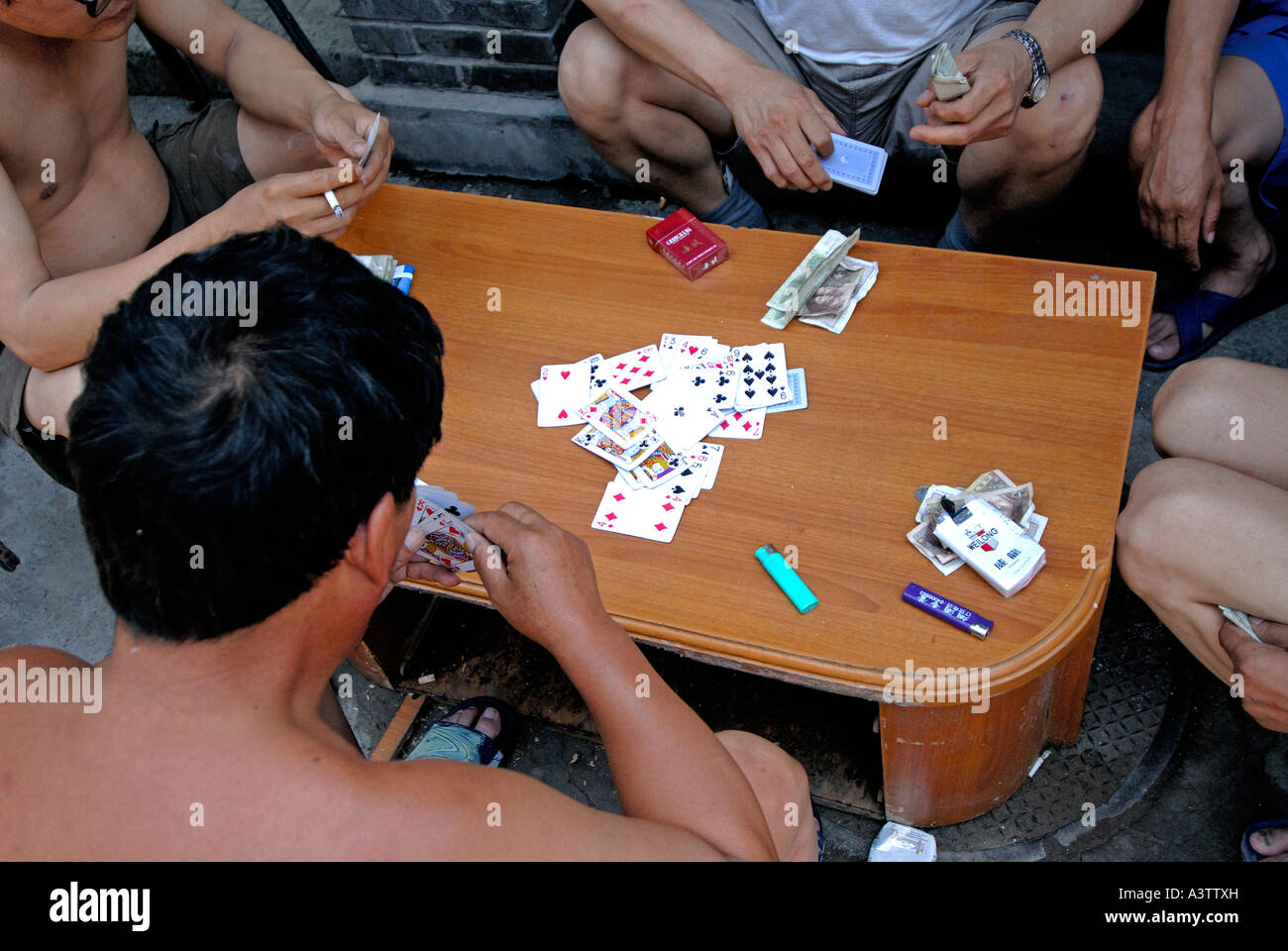 Chinese men playing cards in Beijing Hutong China Stock Photo - Alamy