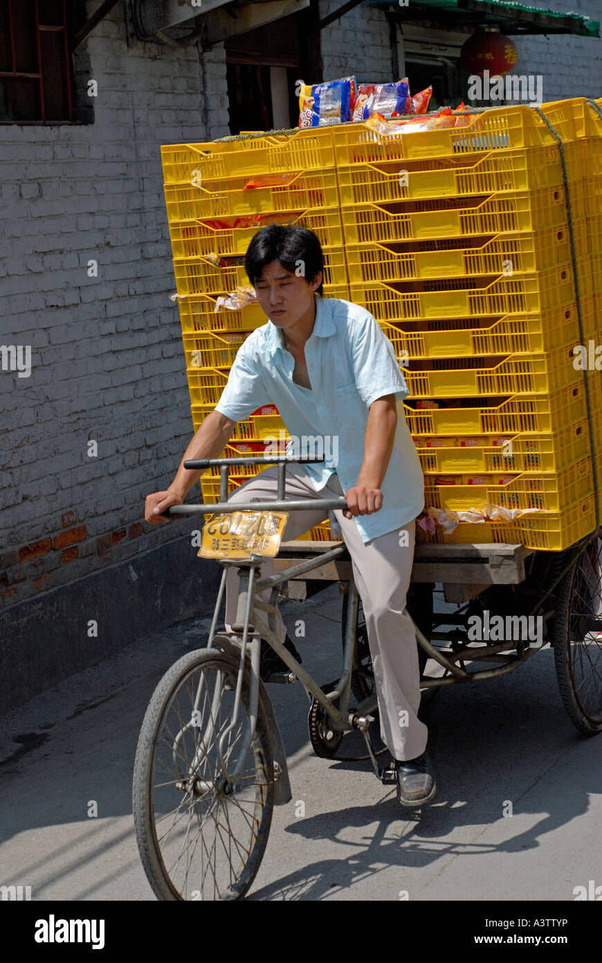Shop delivery with tricycle in Beijing Hutongs China Stock Photo - Alamy