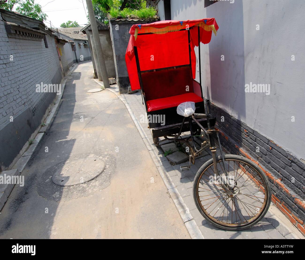 Chinese pedicab waiting in narrow lanes of Beijing Hutong China Stock ...