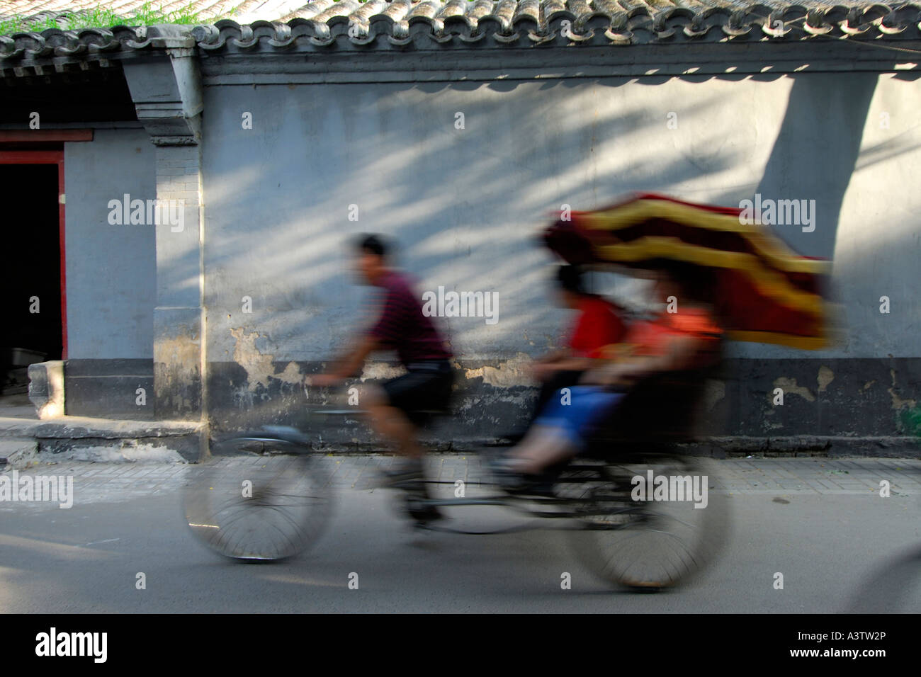 Rickshaw riding in the old streets of Hutong Beijing China Stock Photo ...
