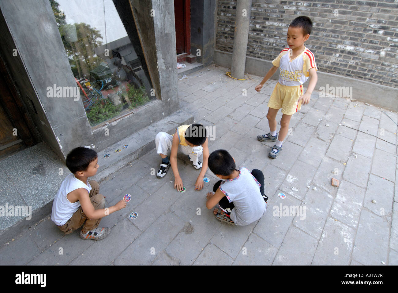 Chinese boys playing in the streets of Beijing Hutong China Stock Photo ...