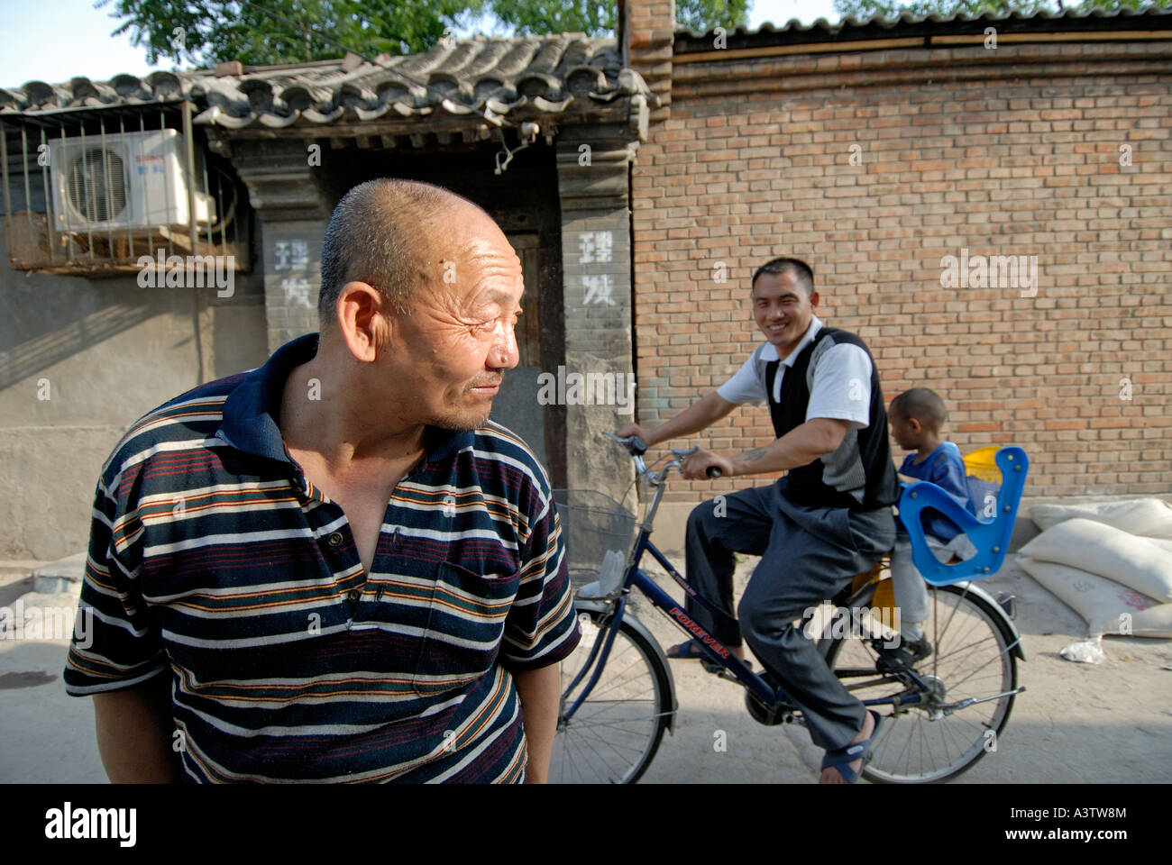 Street life in Hutong the poor quarters of Beijing China Stock Photo ...