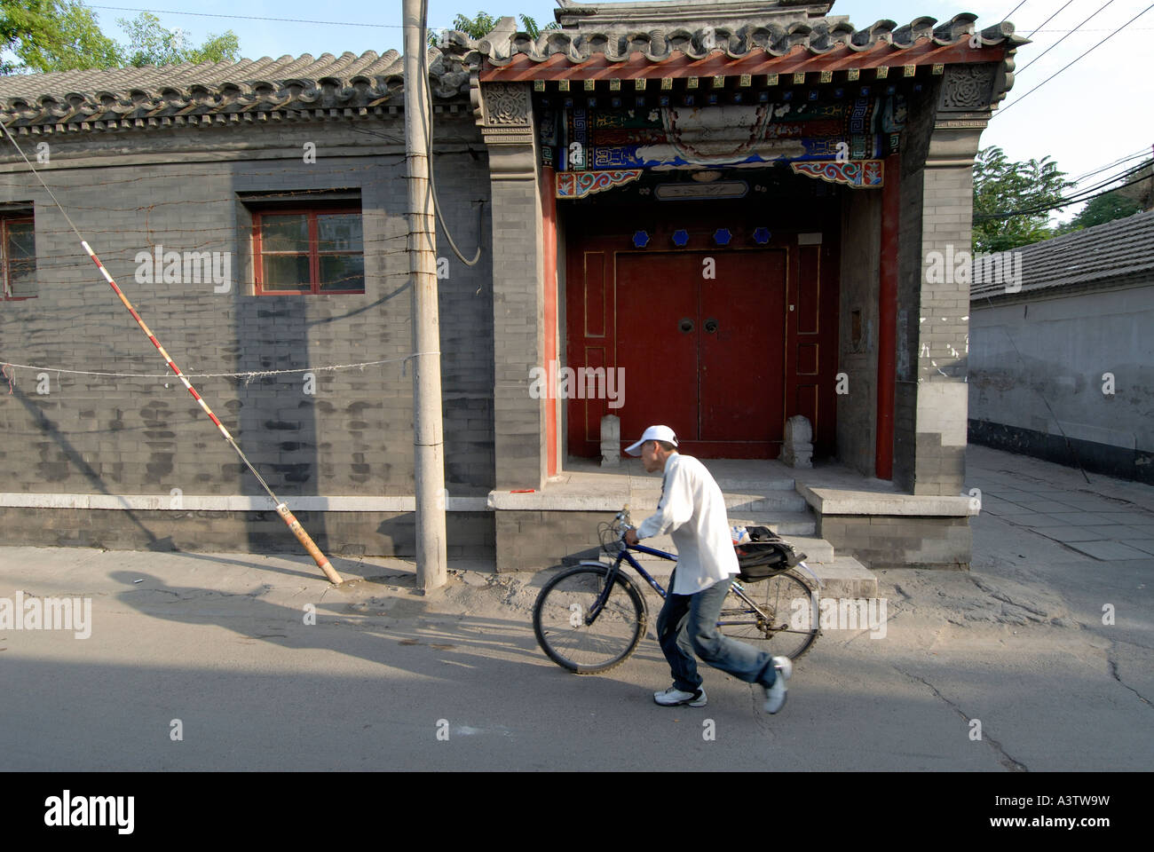 Street scene in Hutong the poor quarters in Beijing China Stock Photo ...