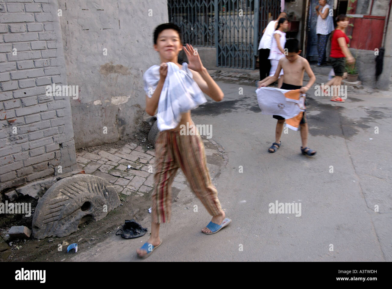 Chinese children playing in the streets of Beijing Hutong China Stock ...