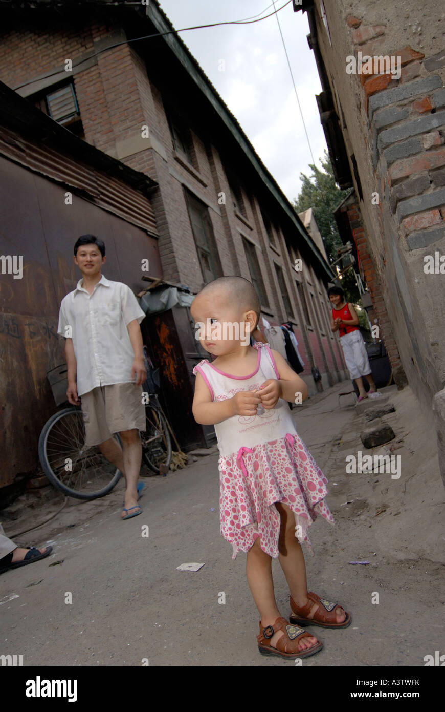 Little Chinese girl in Hutong the poor quarters of Beijing China Stock ...