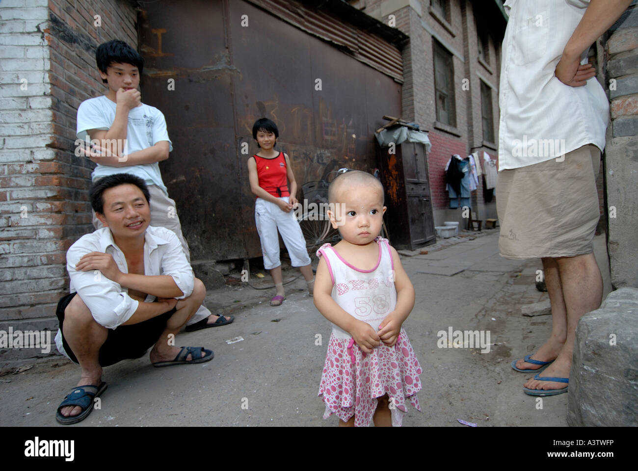 Little Chinese girl in Hutong the poor quarters of Beijing China Stock ...