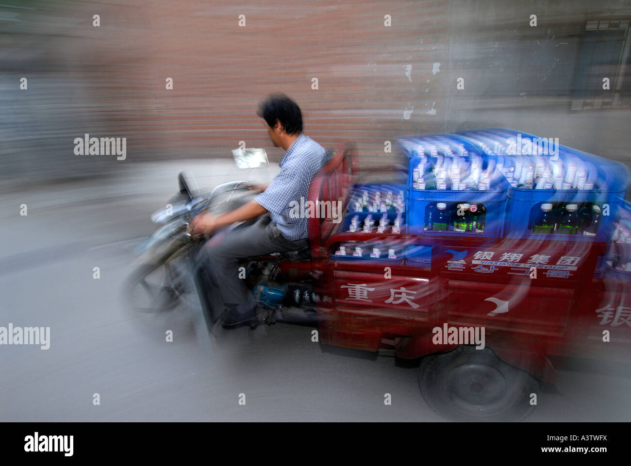 Beijing Hutong in motion Chinese man transporting bottled beer on his ...
