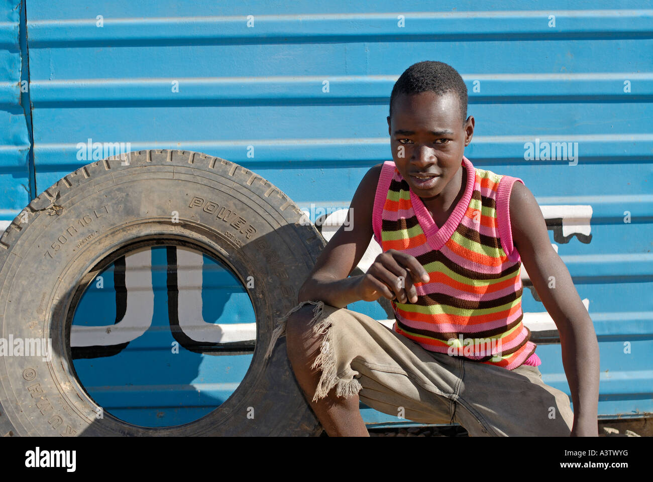 Young Kenyan boy and old tyre Maralal Northern Kenya Stock Photo - Alamy
