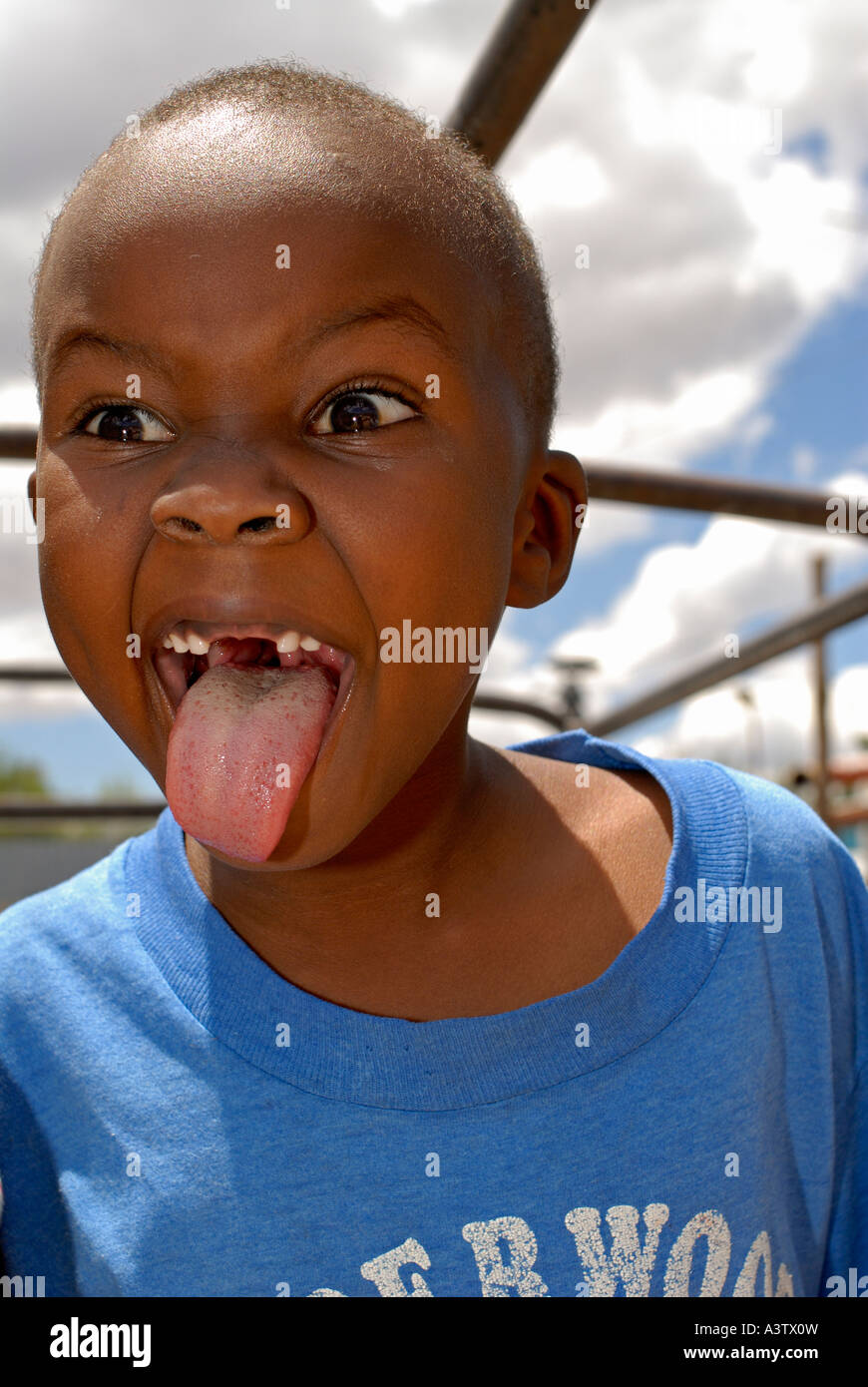 Little Kenyan boy sticking out his tongue Maralal Northern Kenya Stock ...
