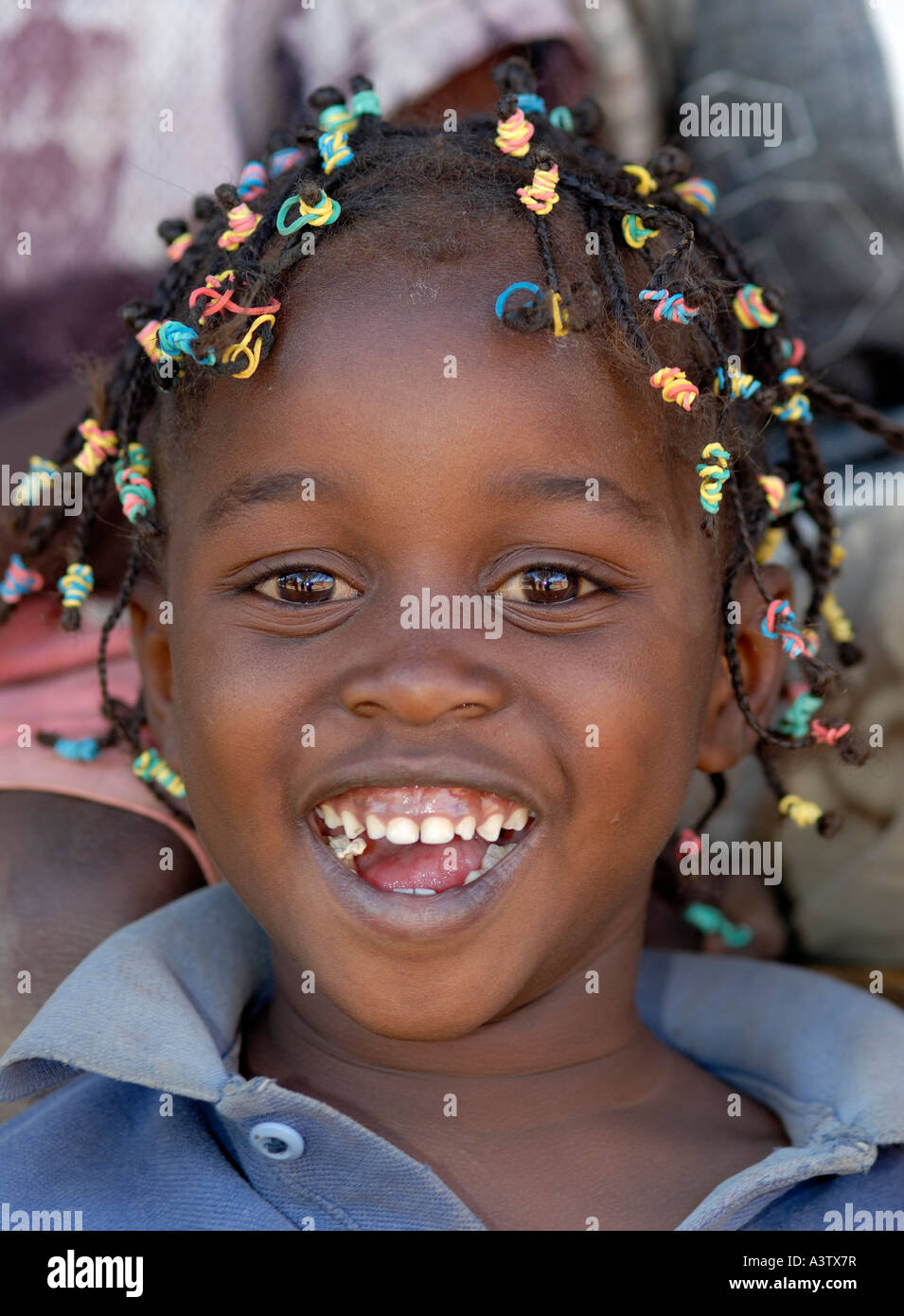 Smiling Kenyan girl with colorful hairstyle Suguta Marmar Kenya Stock ...