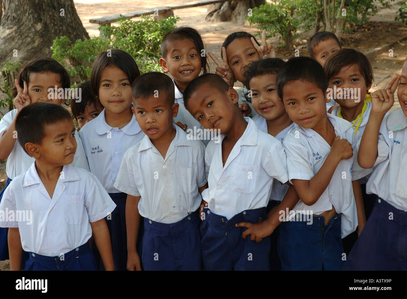 Thai children standing in the driveway during breaktime at school ...