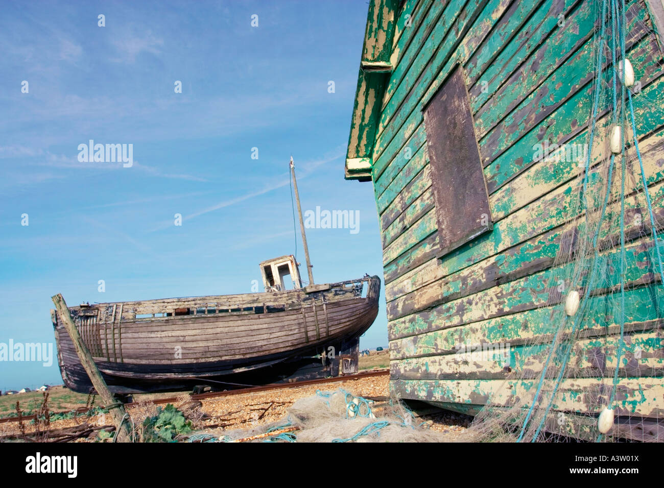 old fishing hut and beached boat Stock Photo - Alamy