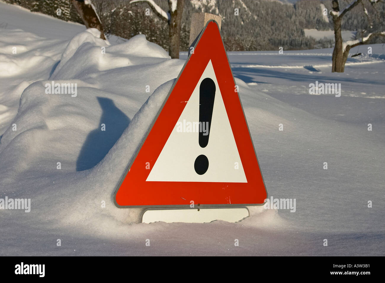 warning sign covered with snow Stock Photo - Alamy