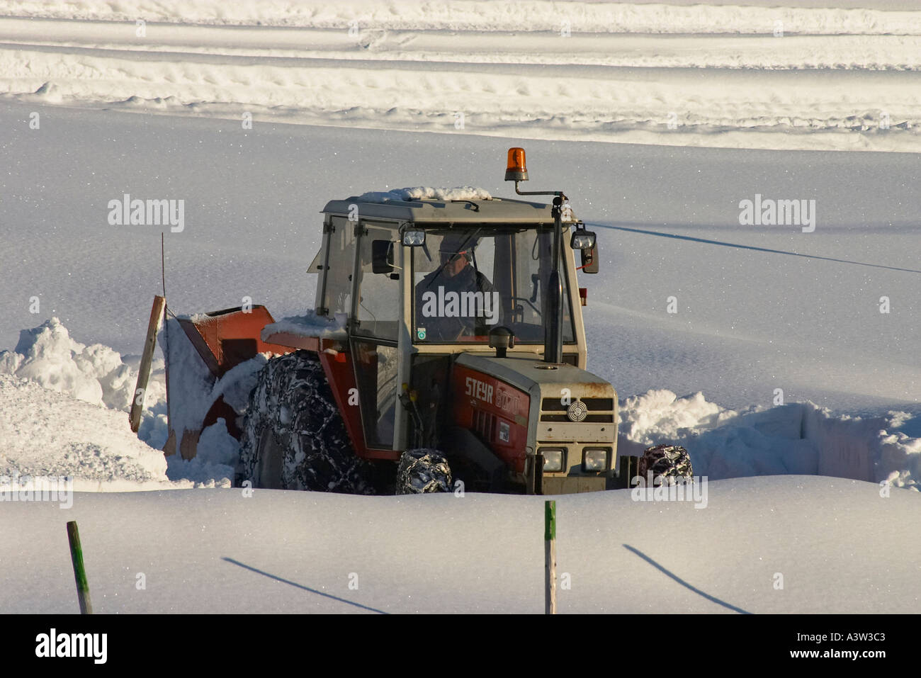 tractor in snow Stock Photo - Alamy