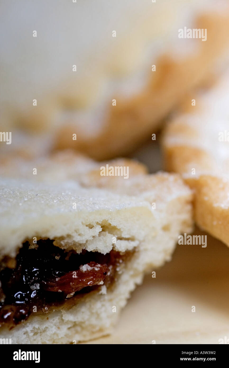 Side up and close view of fresh crusty mince pie cut in half to show ...