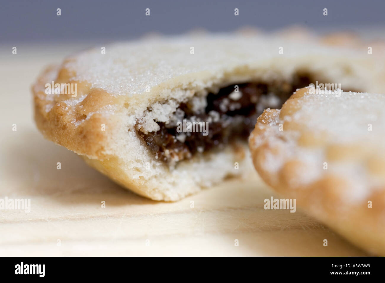 Side up and close view of fresh crusty mince pie cut in half to show ...