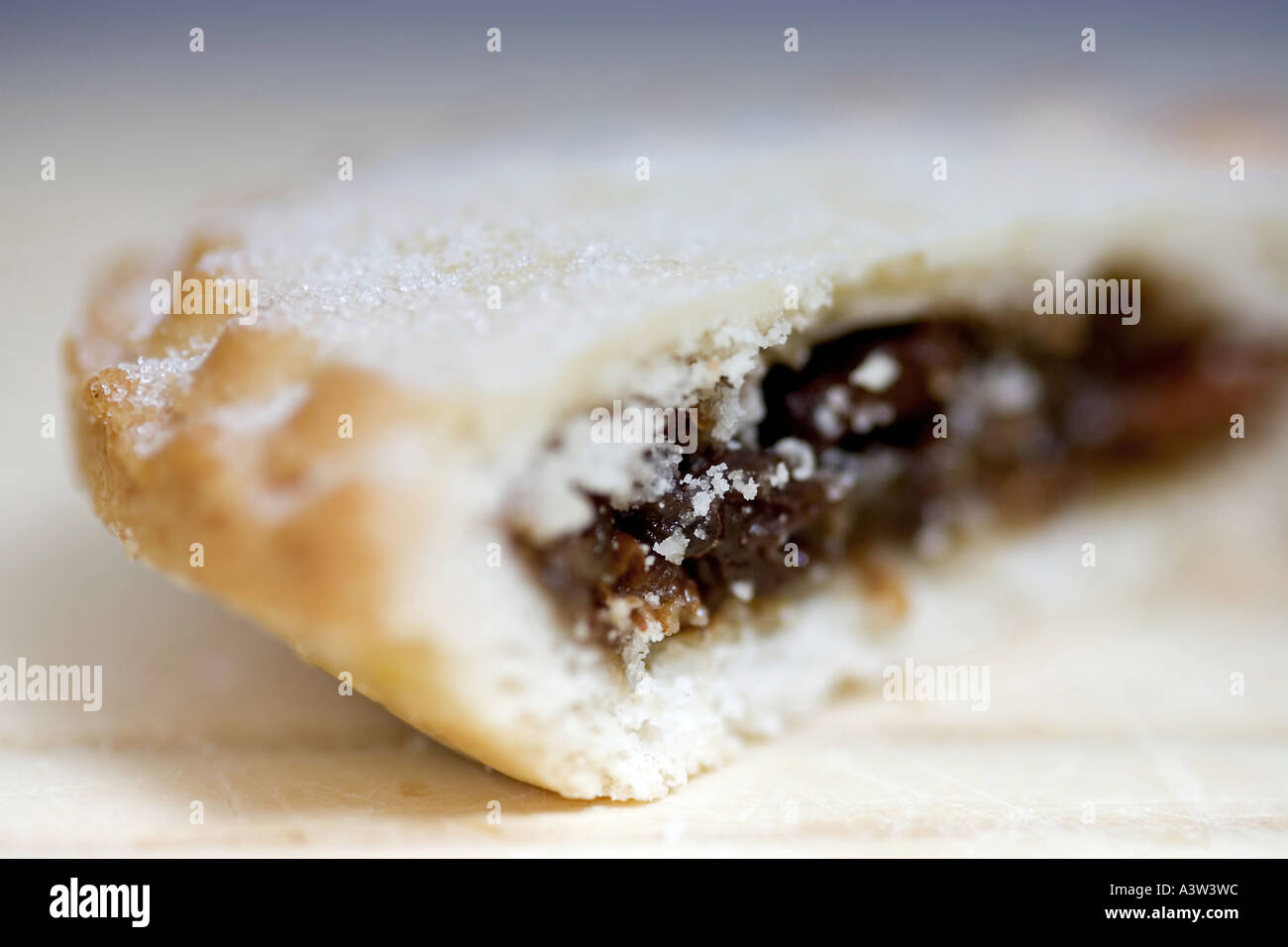 Side up and close view of fresh crusty mince pie cut in half to show ...