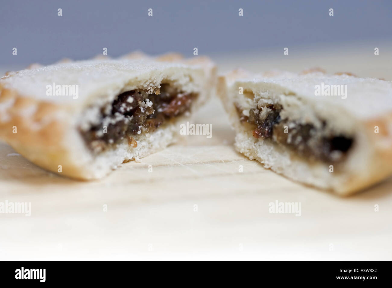 Side up and close view of fresh crusty mince pie cut in half to show ...