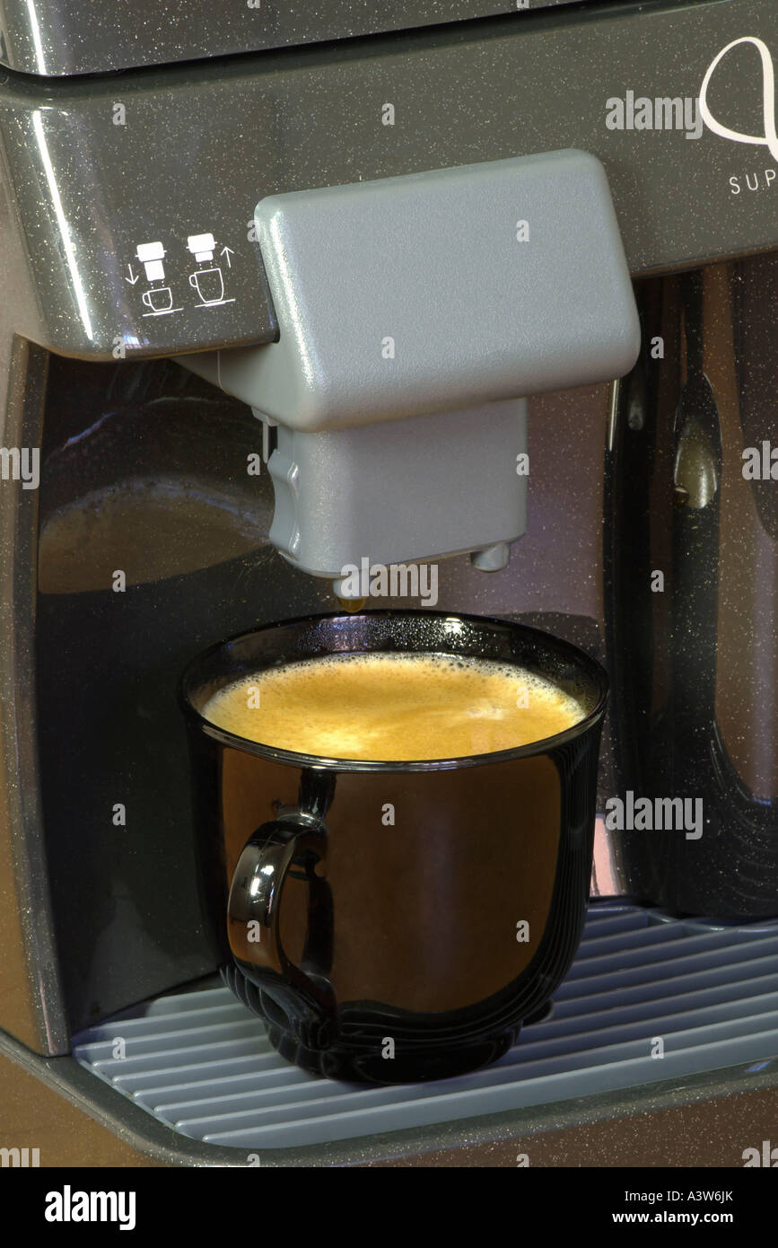 Cup of coffee in Coffee machine Stock Photo - Alamy