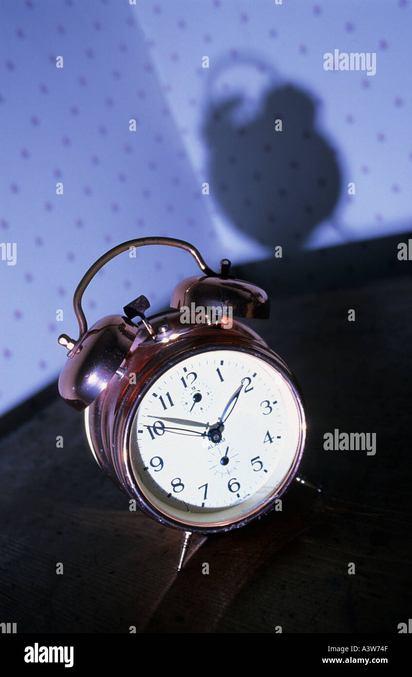 old fashioned clockwork alarm clock in bedroom at night Stock Photo - Alamy